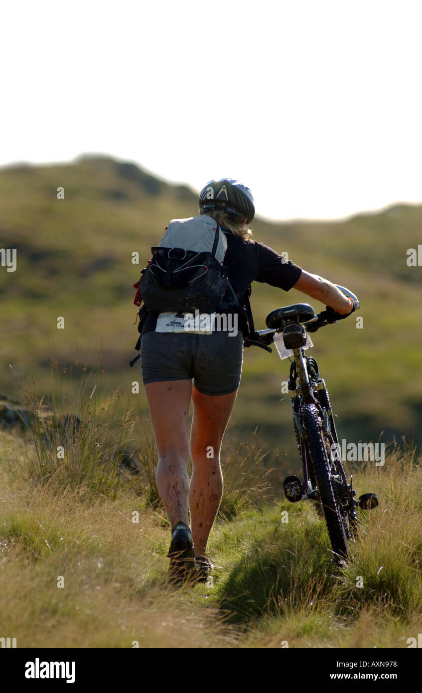 Mountain bike girl push Stock Photo - Alamy