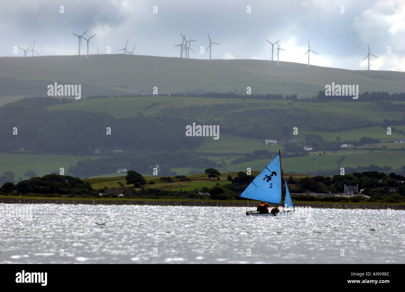 Sail boat and wind turbines Stock Photo - Alamy