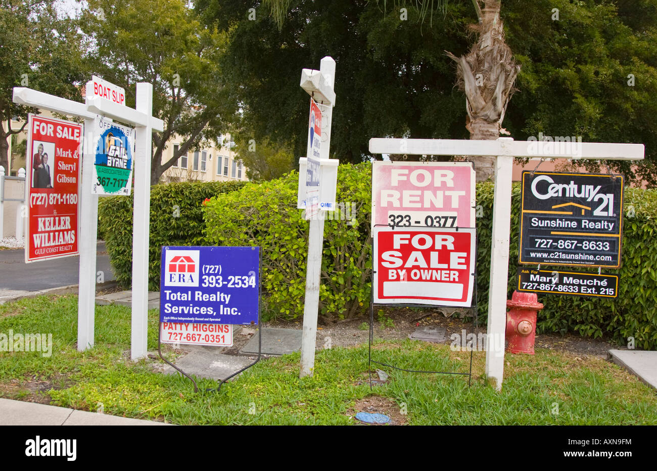 Signs showing many homes for sale Stock Photo - Alamy