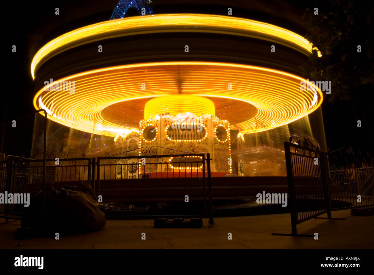 A merry go round at night taken with slow shutter speed Stock Photo - Alamy