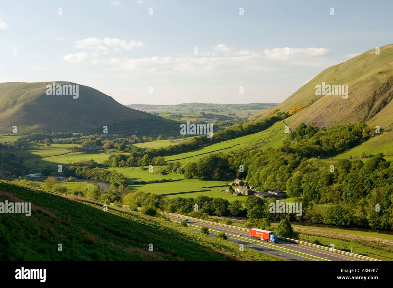 M6 motorway passing through east Cumbria hills, the Howgill Fells, 2 ...