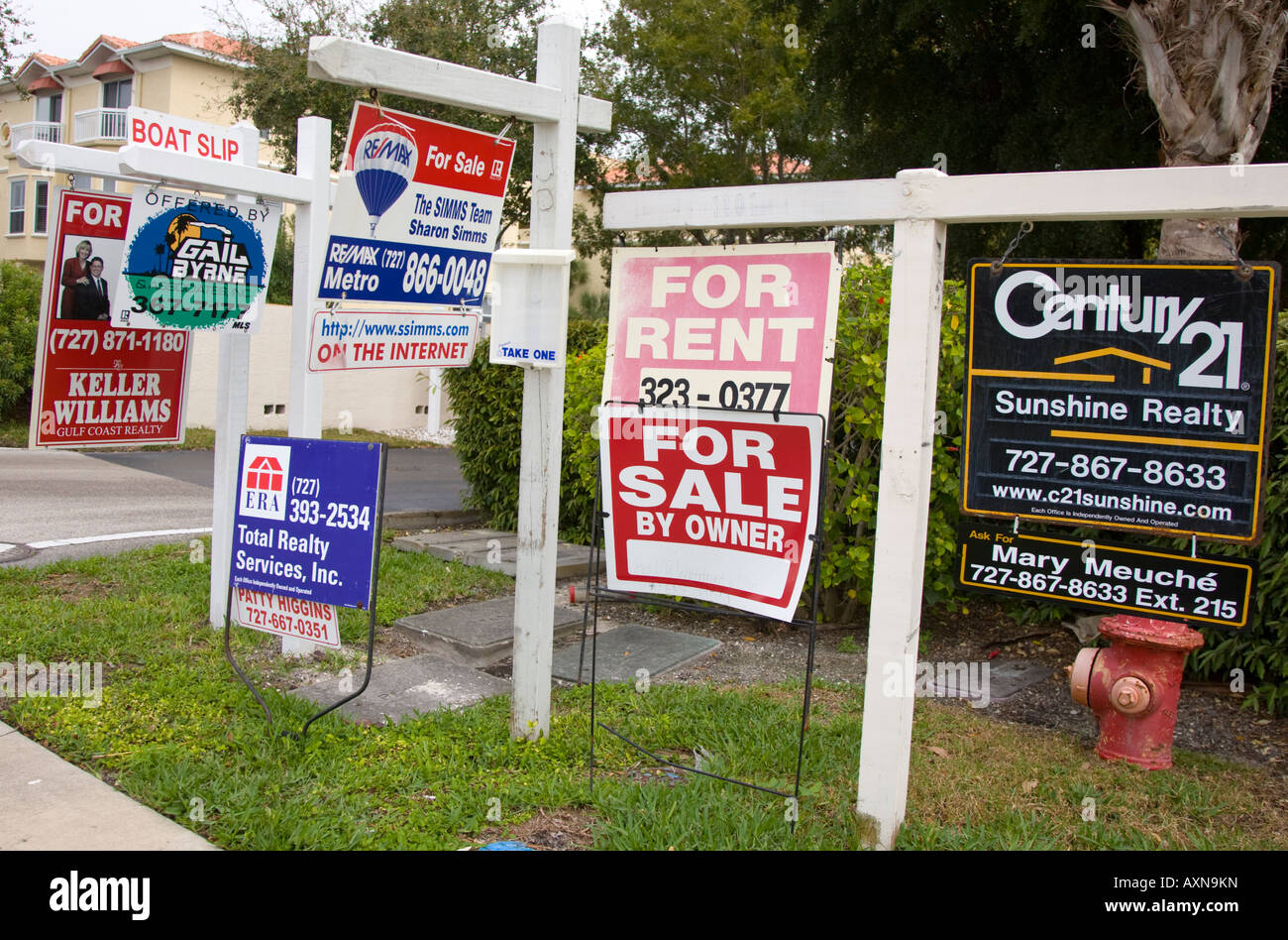 Signs showing many homes for sale Stock Photo - Alamy