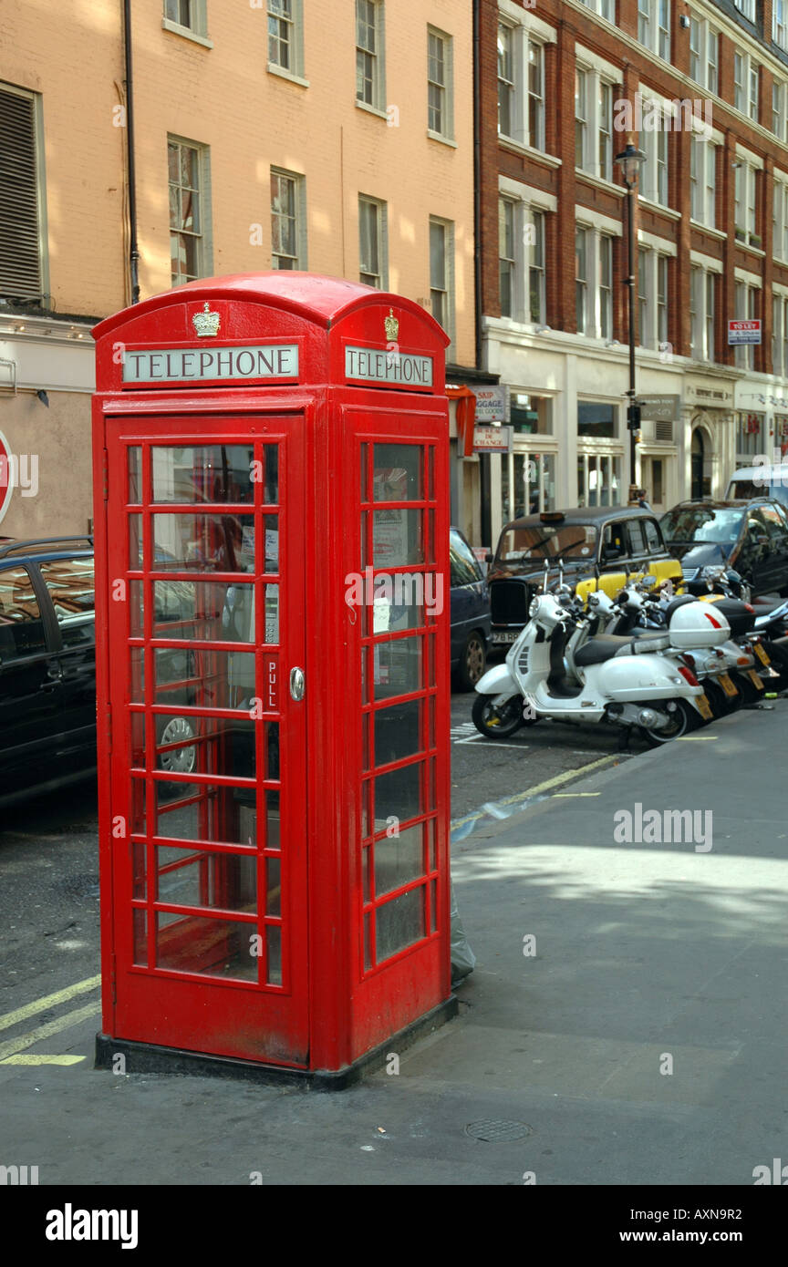 Red traditional phone booth in London, UK Stock Photo - Alamy