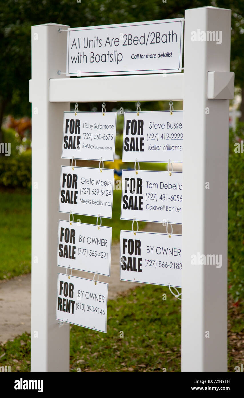 Signs showing several homes for sale Stock Photo - Alamy