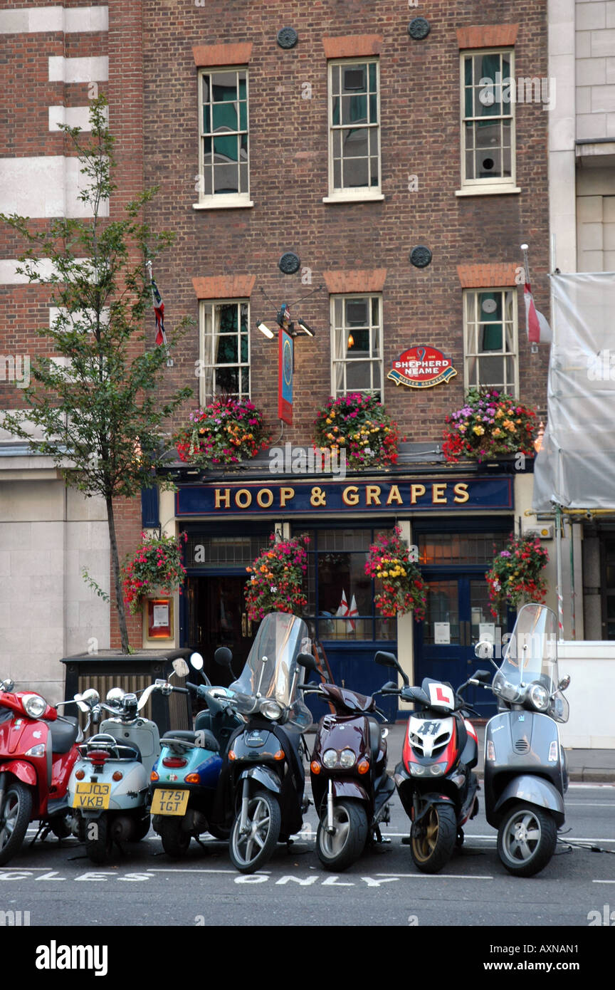 Scooters parked between two lanes of Farringdon Road in London, UK ...
