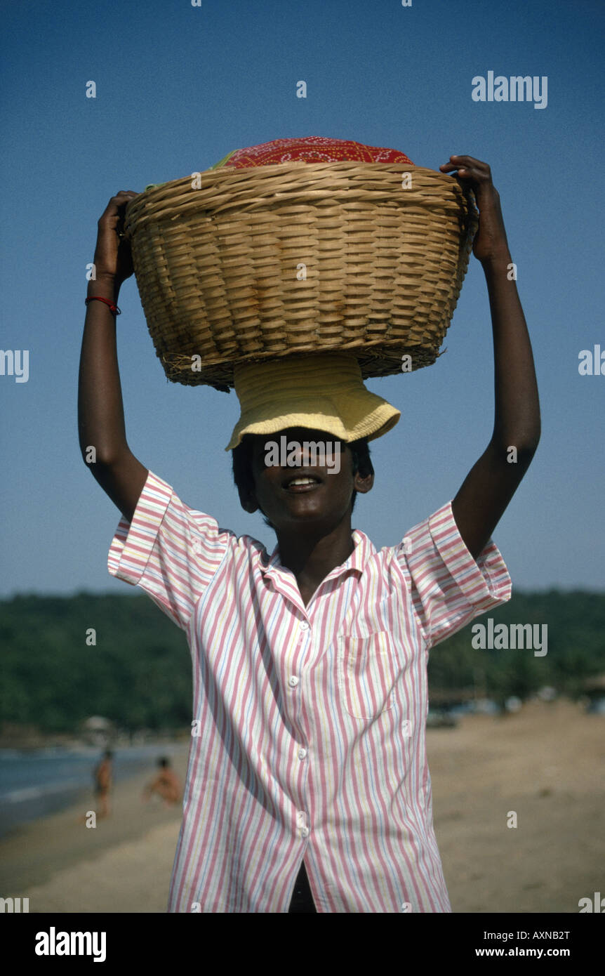 Baga Beach Young boy carrying basket on head Pedlar Stock Photo - Alamy