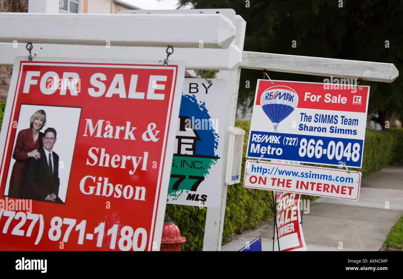 Signs showing many homes for sale Stock Photo - Alamy