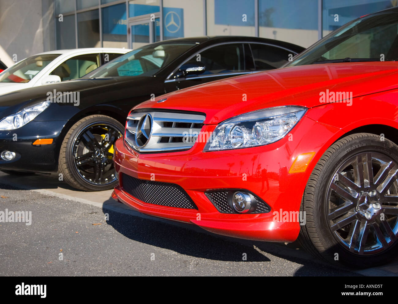 Luxury cars on display at a car lot Stock Photo - Alamy