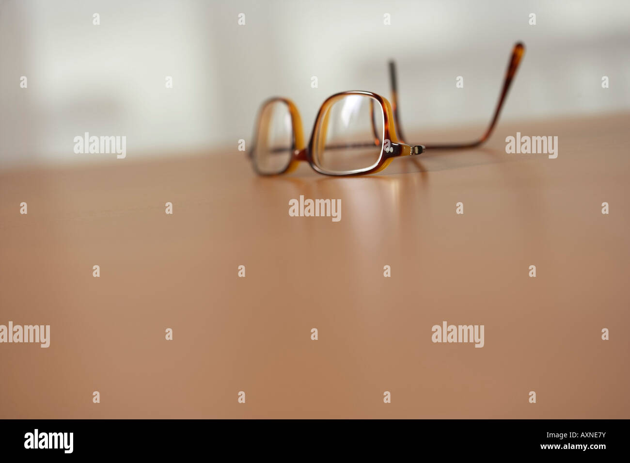 Spectacles on a table Stock Photo - Alamy