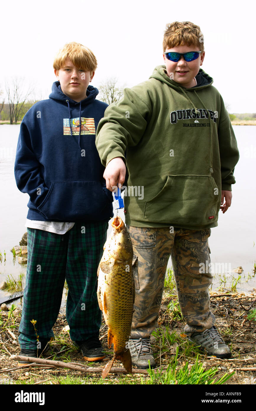 FISHING Fox River Illinois Two boys hold up large carp caught in the ...