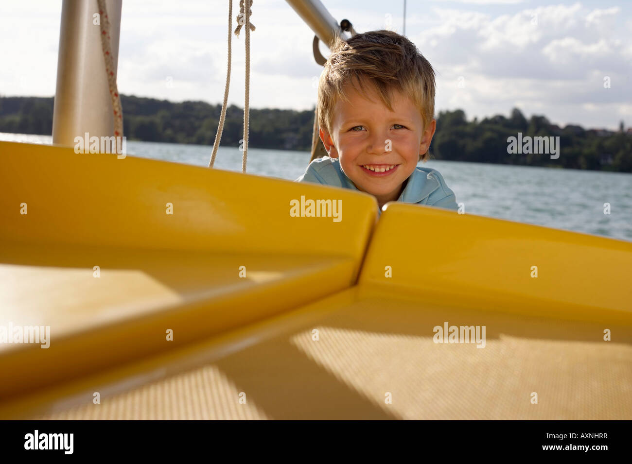 Boy peering over edge hi-res stock photography and images - Alamy