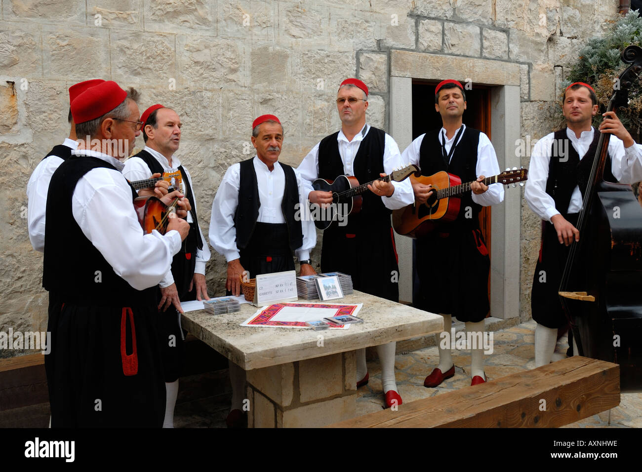 Folk singers in traditional dress in the village of Cilipi in Croatia ...