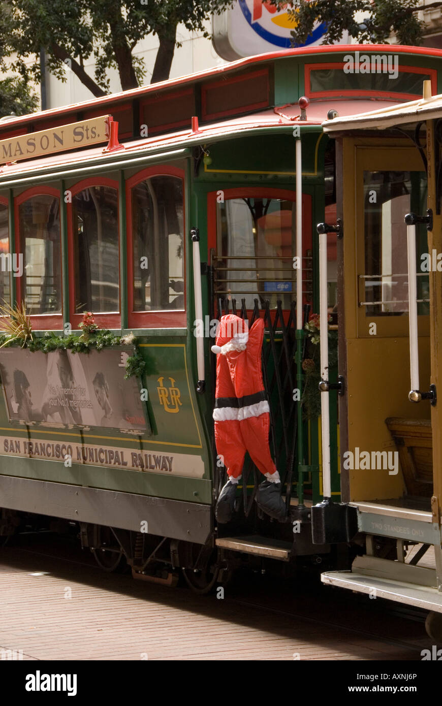 A toy Santa Claus clinging to a Cable Car in San Francisco Stock Photo ...