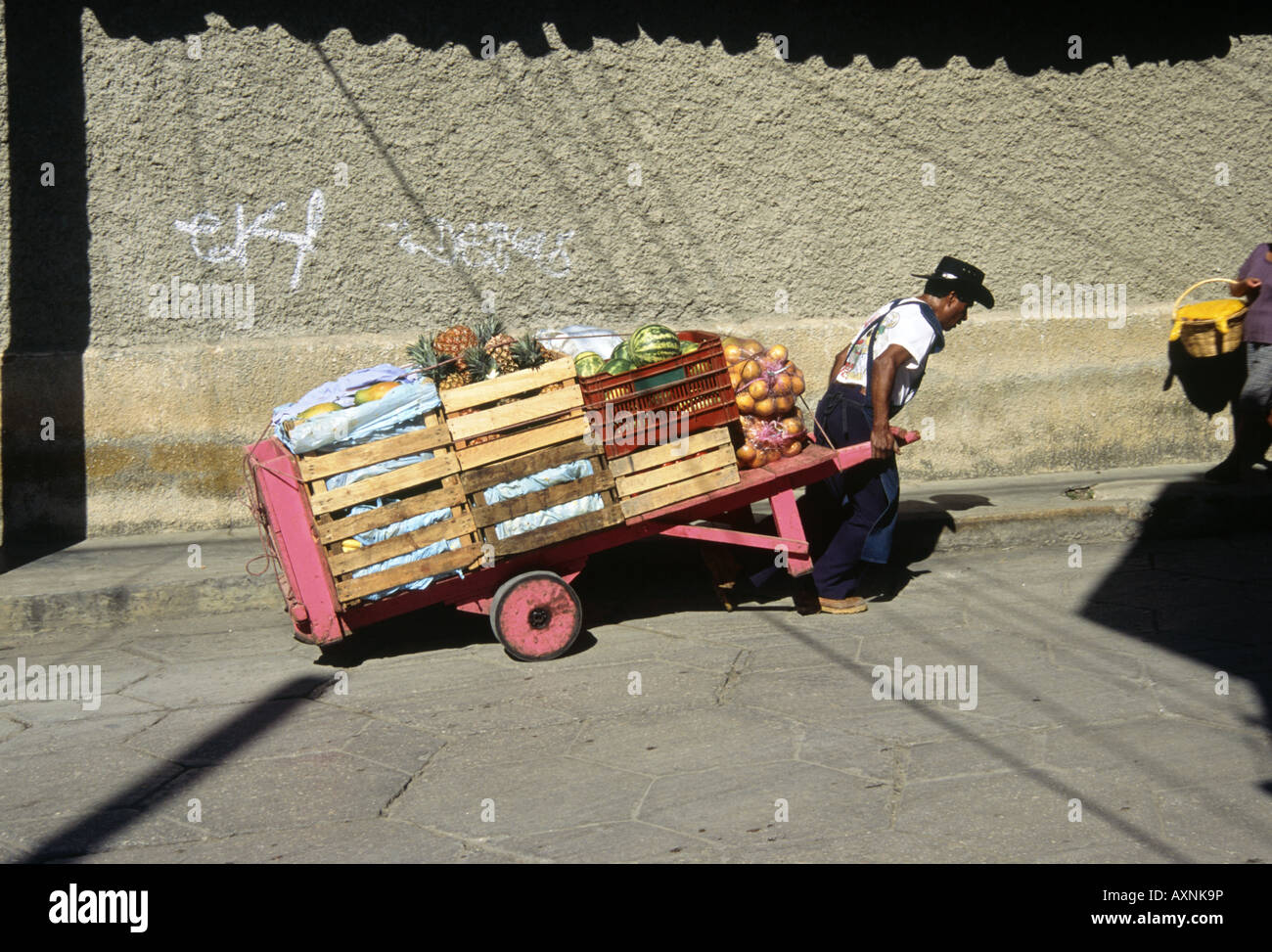 Street Market Trader pulling cart loaded with goods Fruit vegetables ...