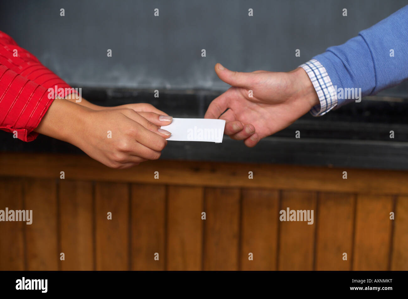 Passing on a note hi-res stock photography and images - Alamy