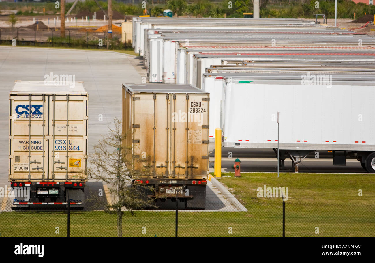 Trailers at a warehouse Stock Photo - Alamy