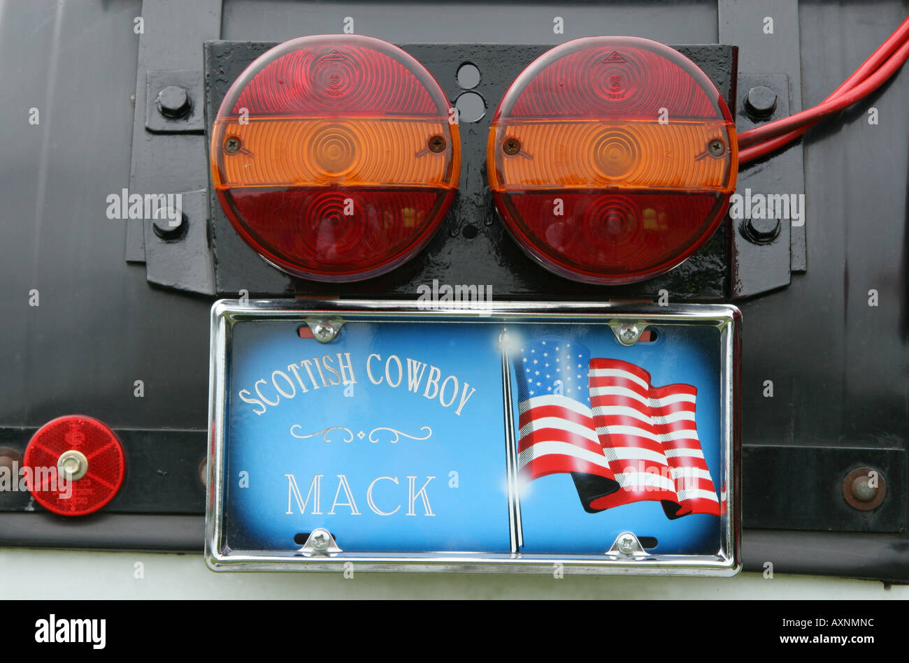 Sign on back of Mack truck with rear lights Stock Photo - Alamy