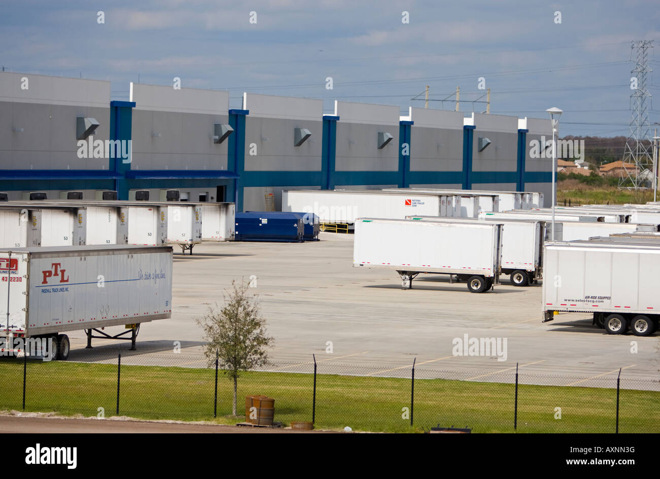 Trailers at a warehouse Stock Photo - Alamy