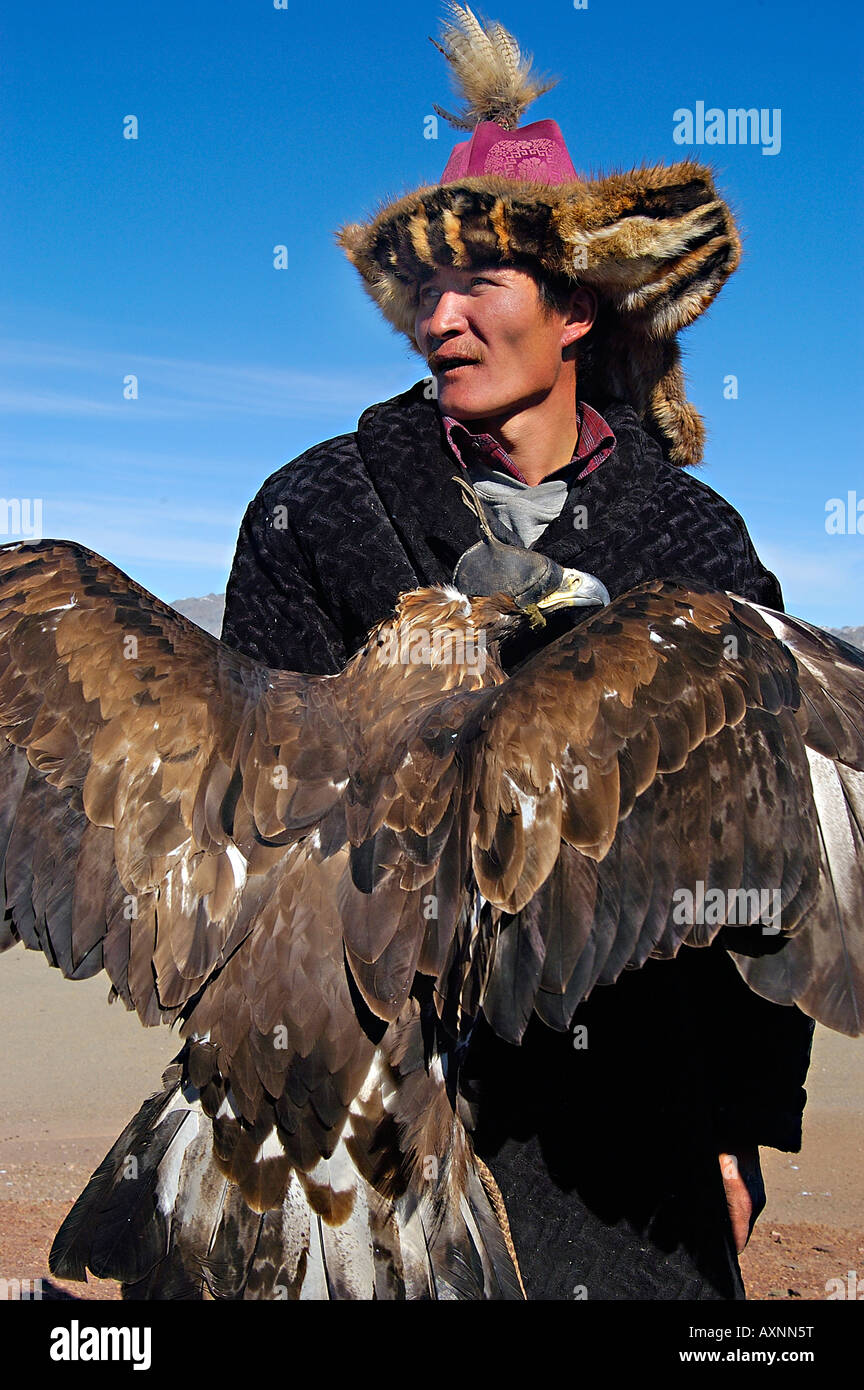 An eagle hunter prepares to demonstrate his eagle for spectators at the ...