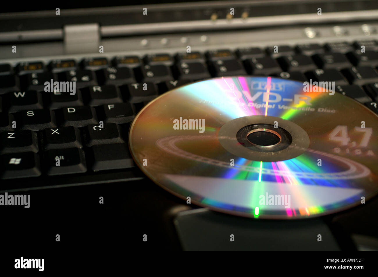 DVD on laptop keyboard light diffraction spectrum colours Stock Photo ...