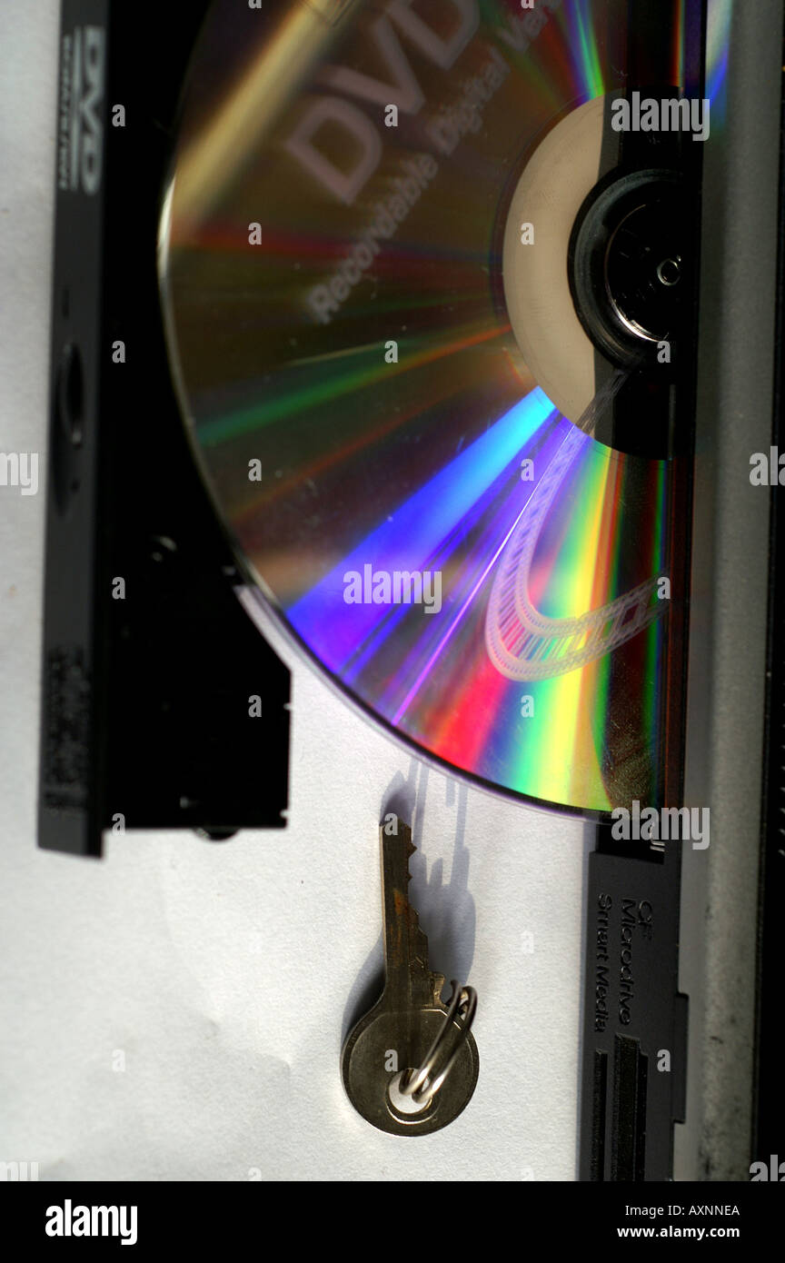 DVD on loading tray for optical reader with key Stock Photo - Alamy