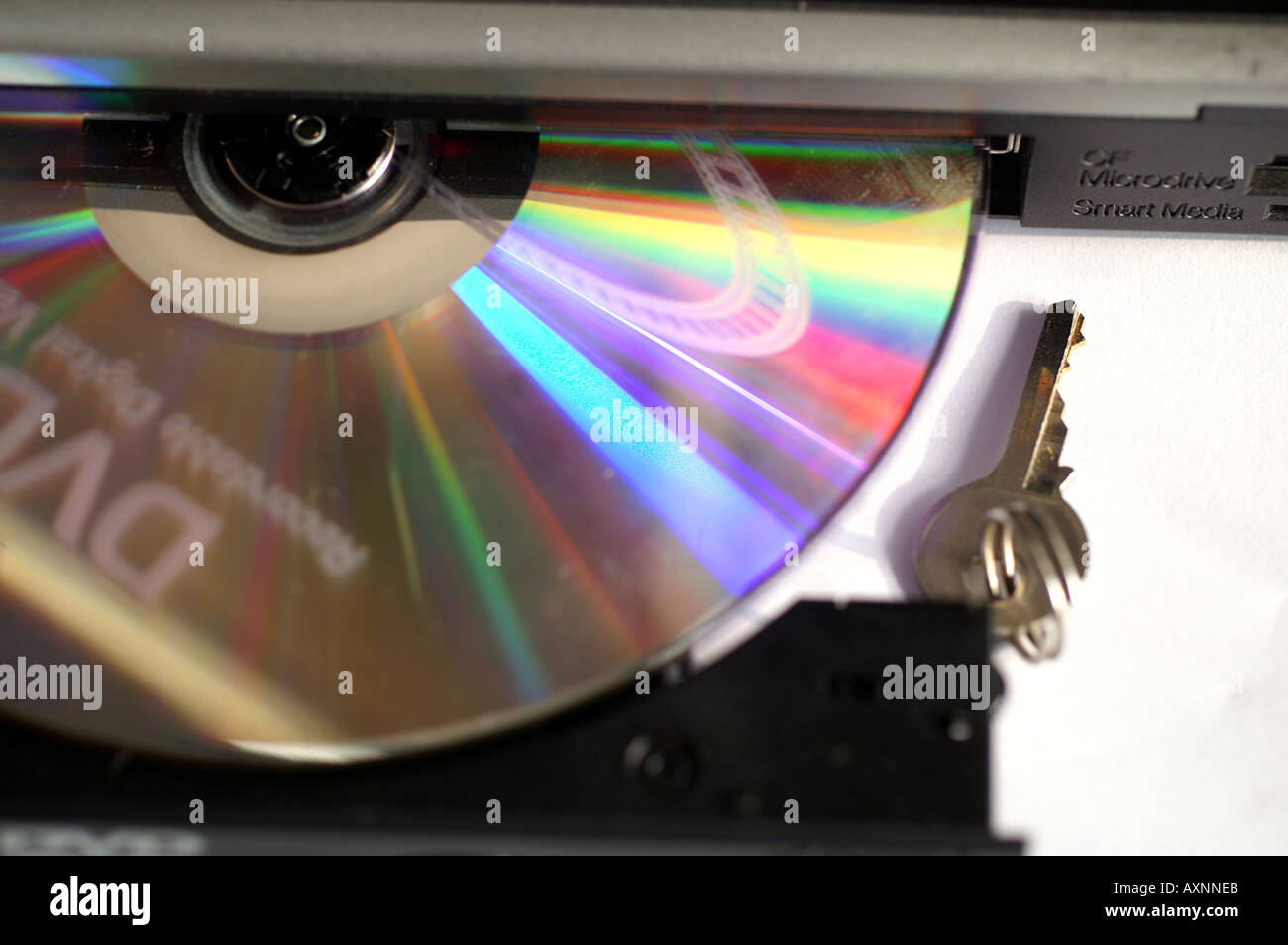 DVD on loading tray for optical reader with key Stock Photo - Alamy