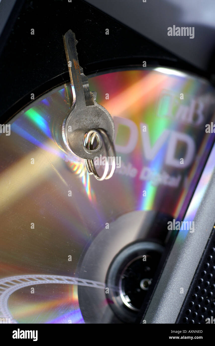 DVD on loading tray for optical reader with key Stock Photo - Alamy