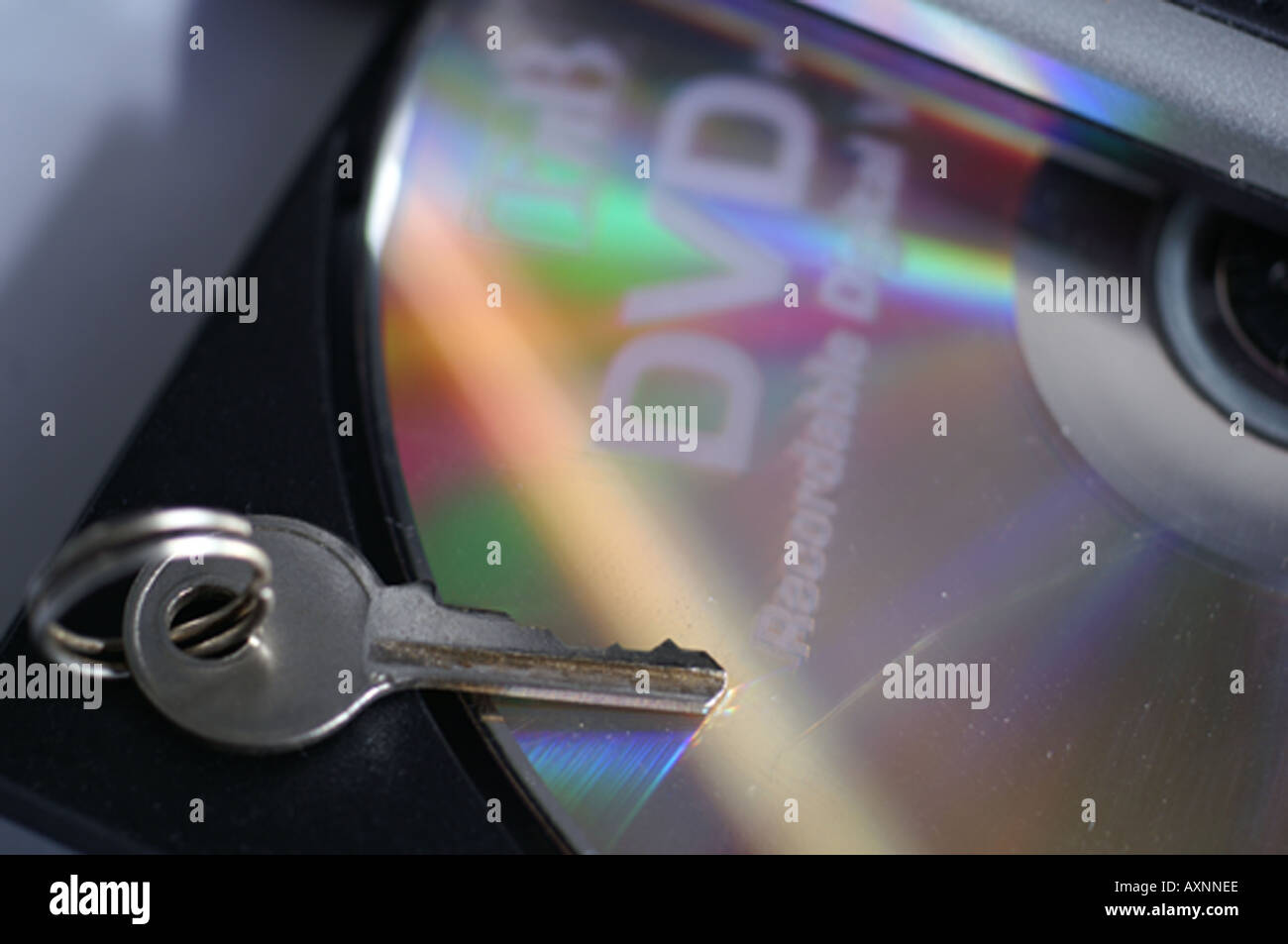 DVD on loading tray for optical reader with key Stock Photo - Alamy