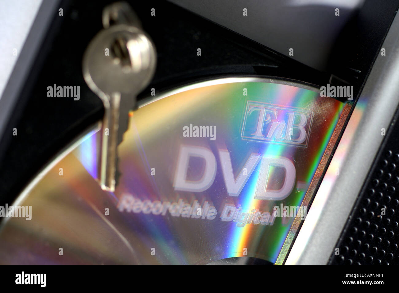 DVD on loading tray for optical reader with key Stock Photo - Alamy