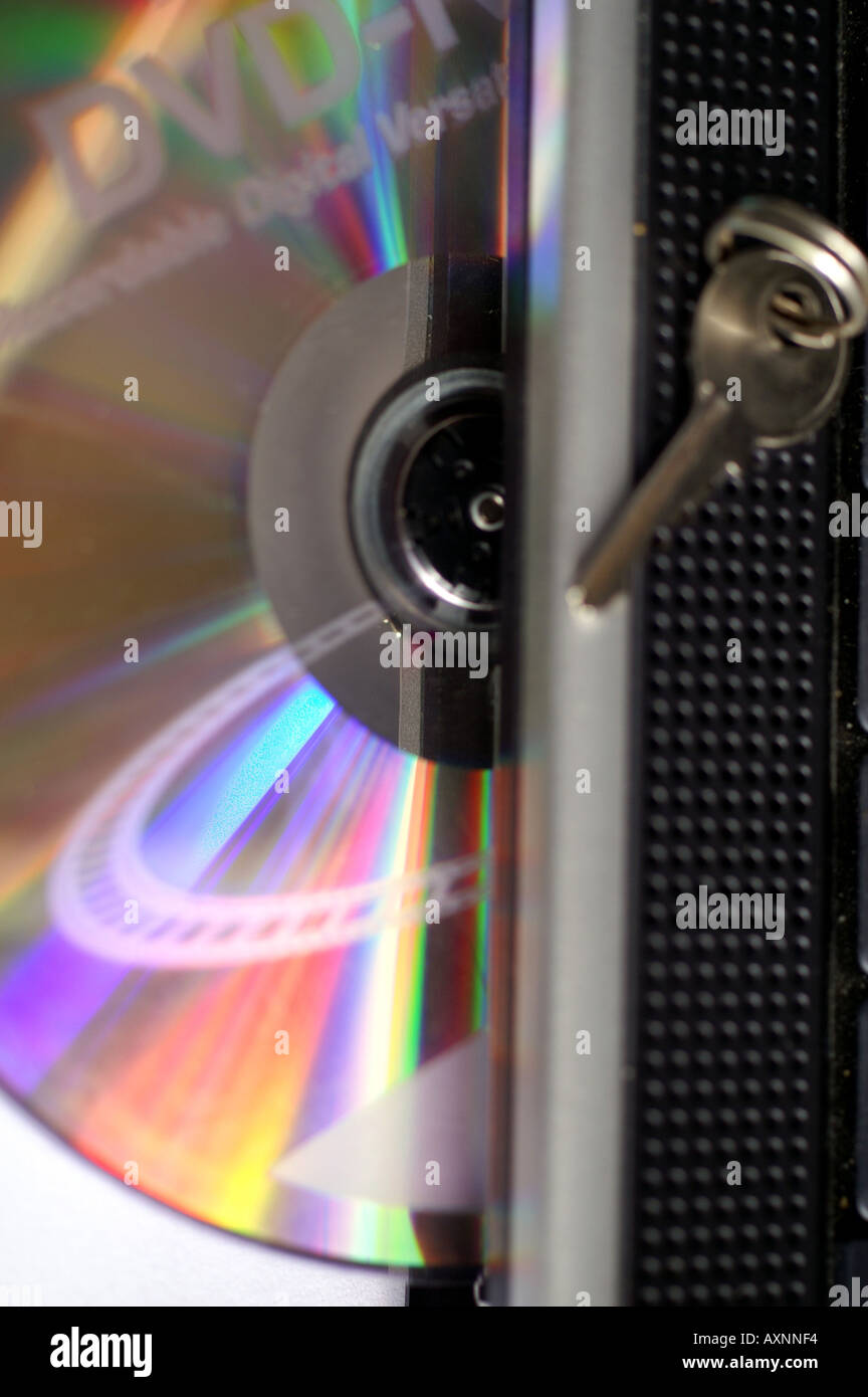 DVD on loading tray for optical reader with key Stock Photo - Alamy