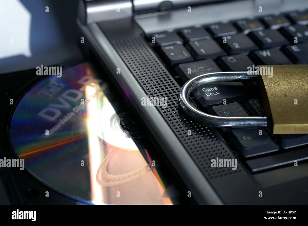 Open padlock around Caps lock key on laptop keyboard with disc Stock ...