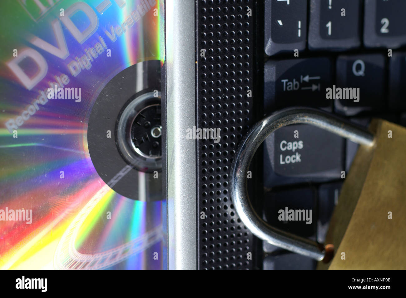 Open padlock around Caps lock key on laptop keyboard with disc Stock ...