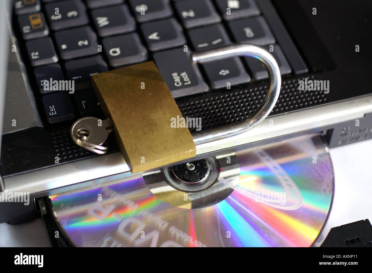 Open padlock around Caps lock key on laptop keyboard with disc Stock ...