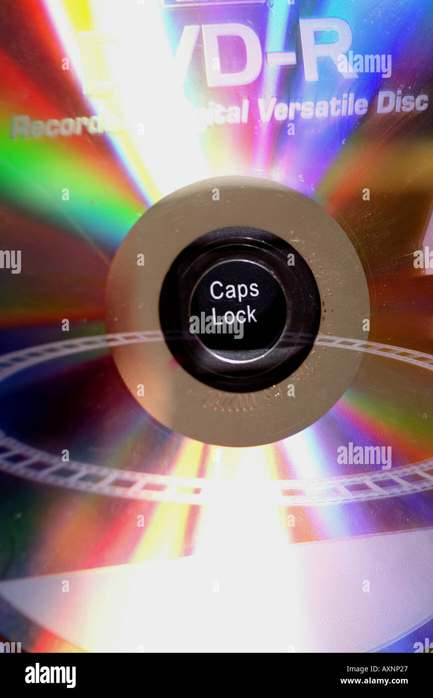 DVD hole around caps lock light diffraction spectrum colours disc audio video Stock Photo - Alamy