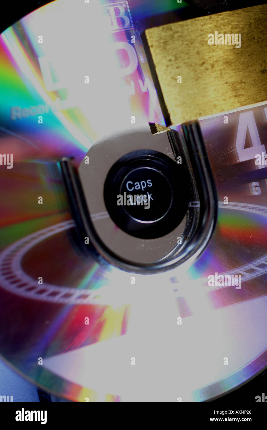 DVD hole around caps lock light diffraction spectrum colours disc audio video with padlock Stock ...