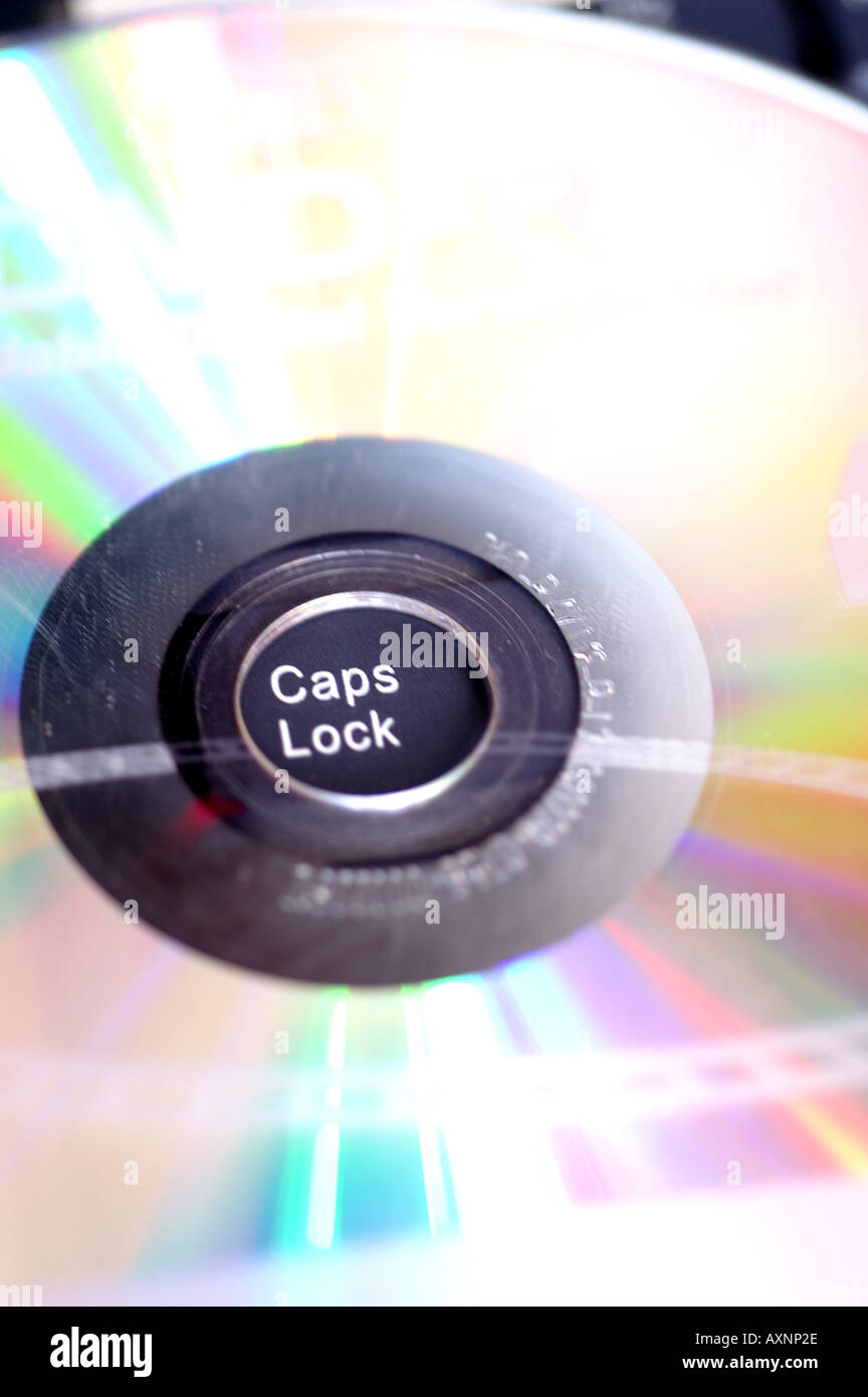 DVD hole around caps lock light diffraction spectrum colours disc audio video Stock Photo - Alamy
