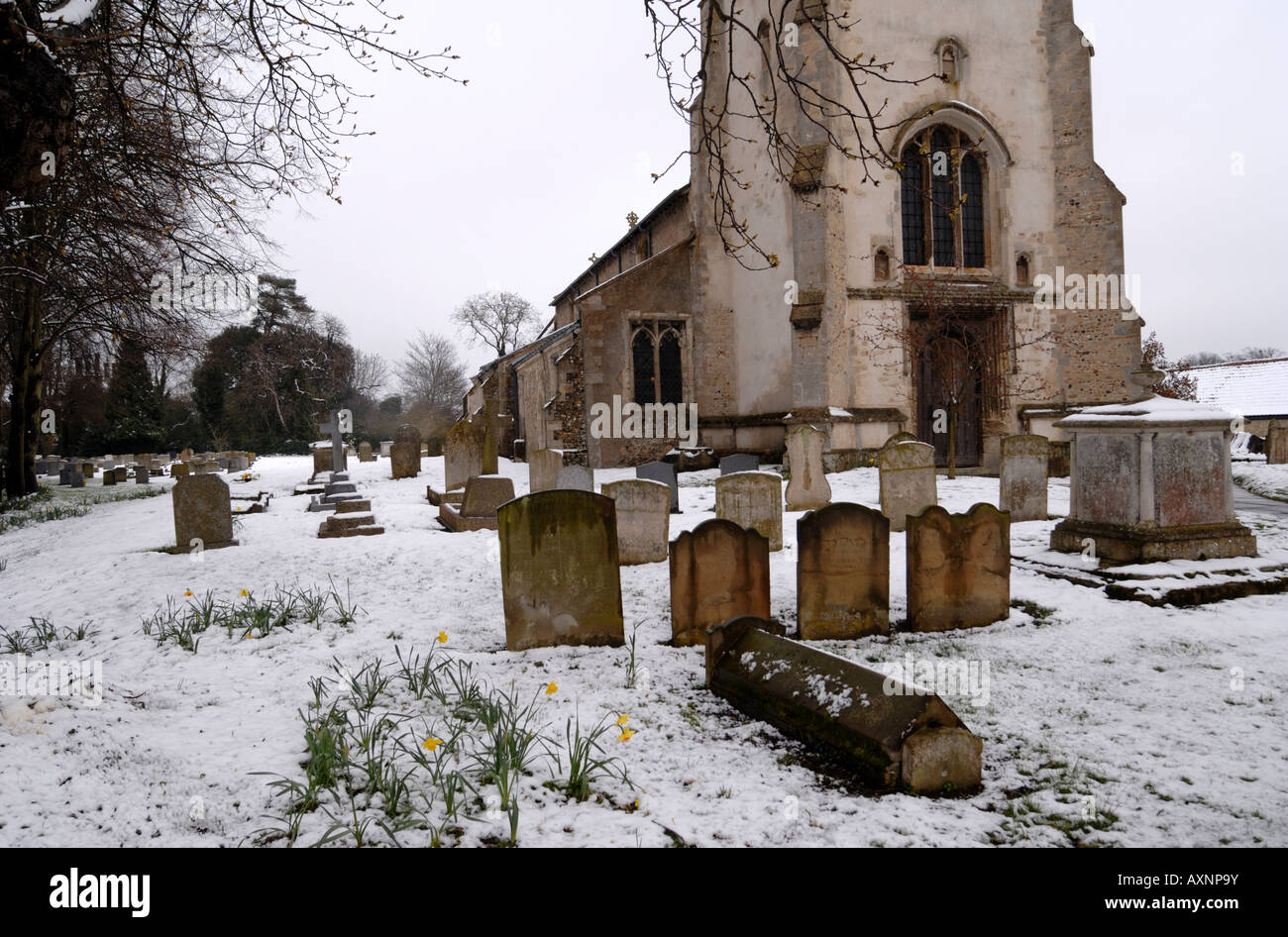 winter scene of church graveyard in snow. Chippenham, Cambs Stock Photo ...