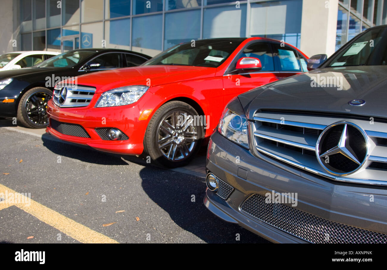 Luxury cars on display at a car lot Stock Photo - Alamy