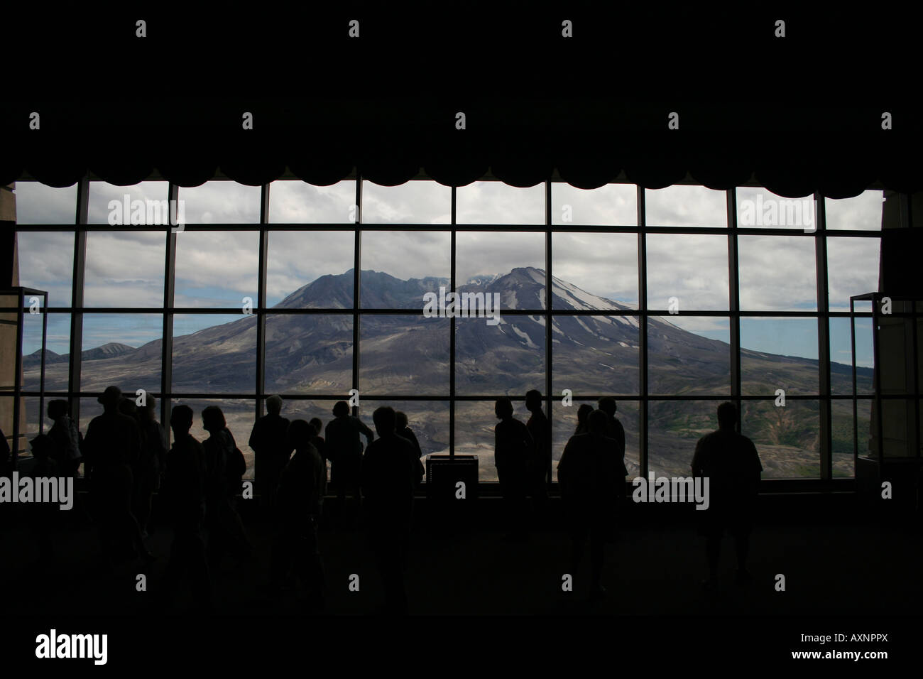 visitors peer through the window after watching a film about the ...