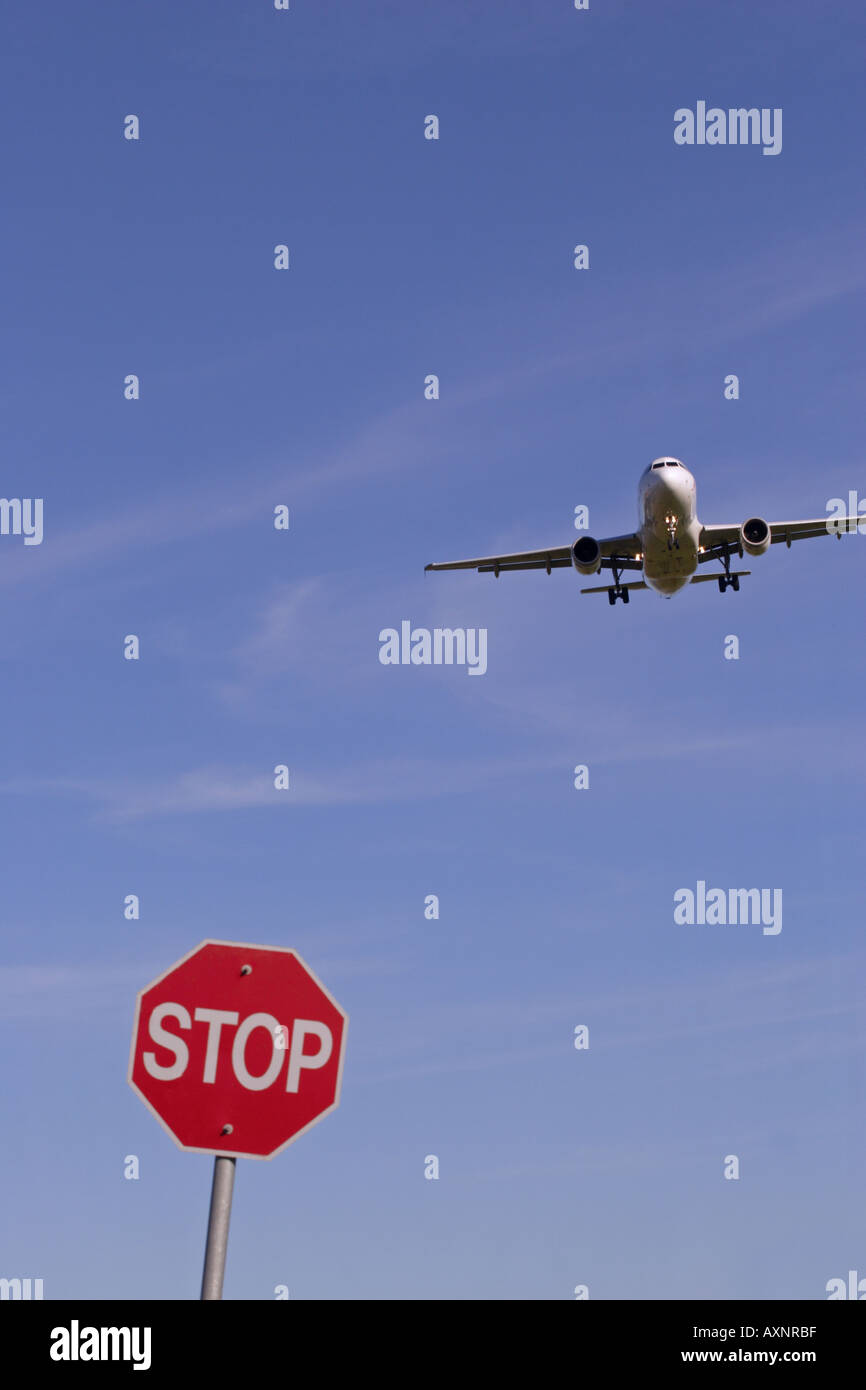 Airplane and stop sign Stock Photo - Alamy