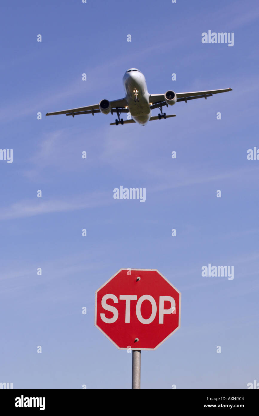 Airplane and stop sign Stock Photo - Alamy