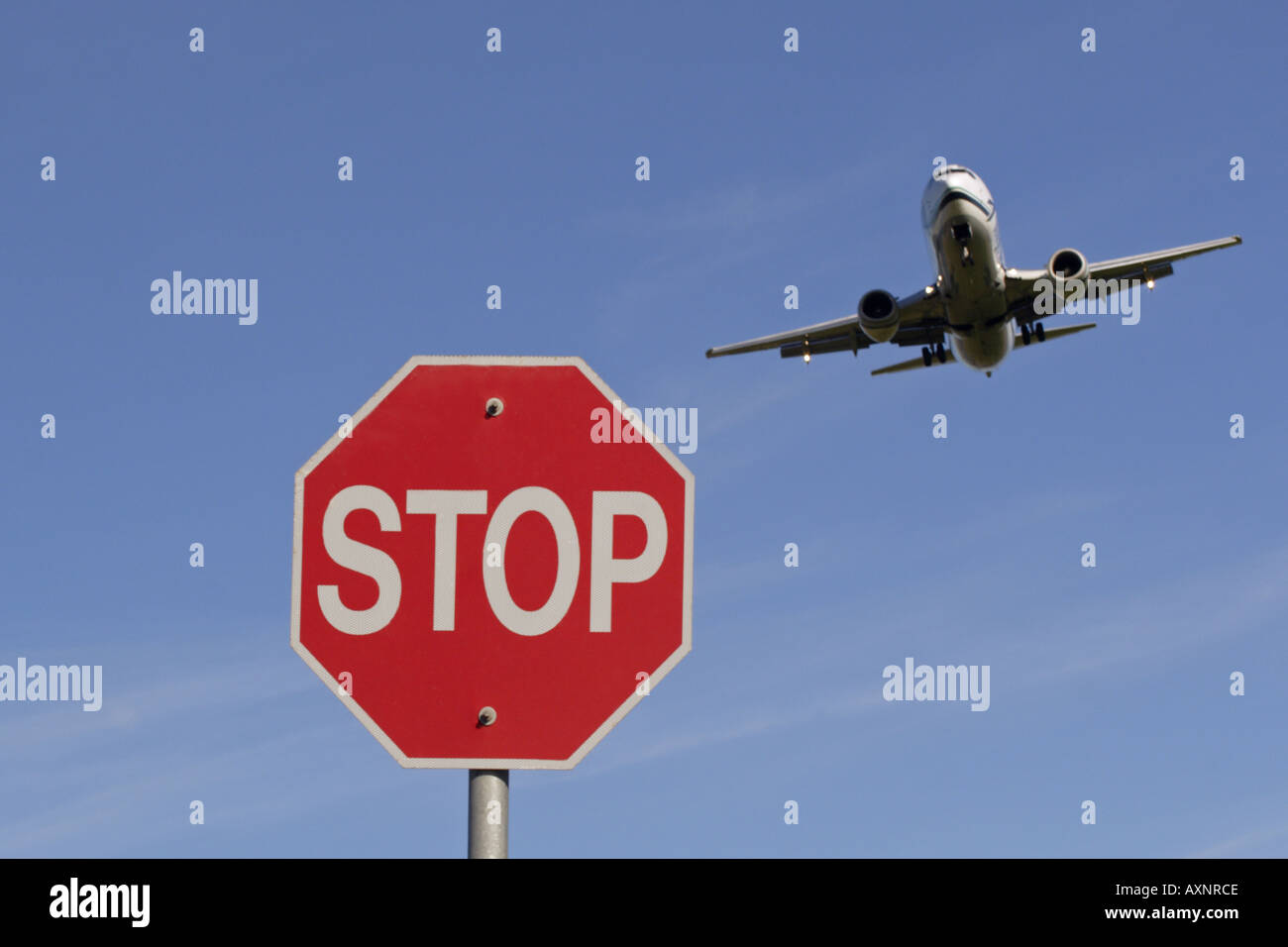 Airplane and stop sign Stock Photo - Alamy