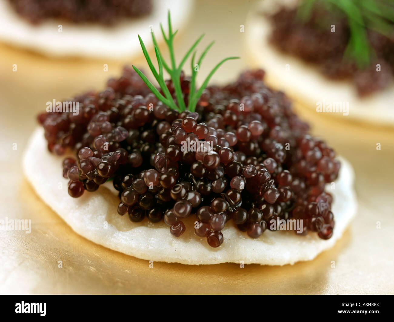 RUSSIAN CAVIAR ON RICE CRACKER Stock Photo - Alamy