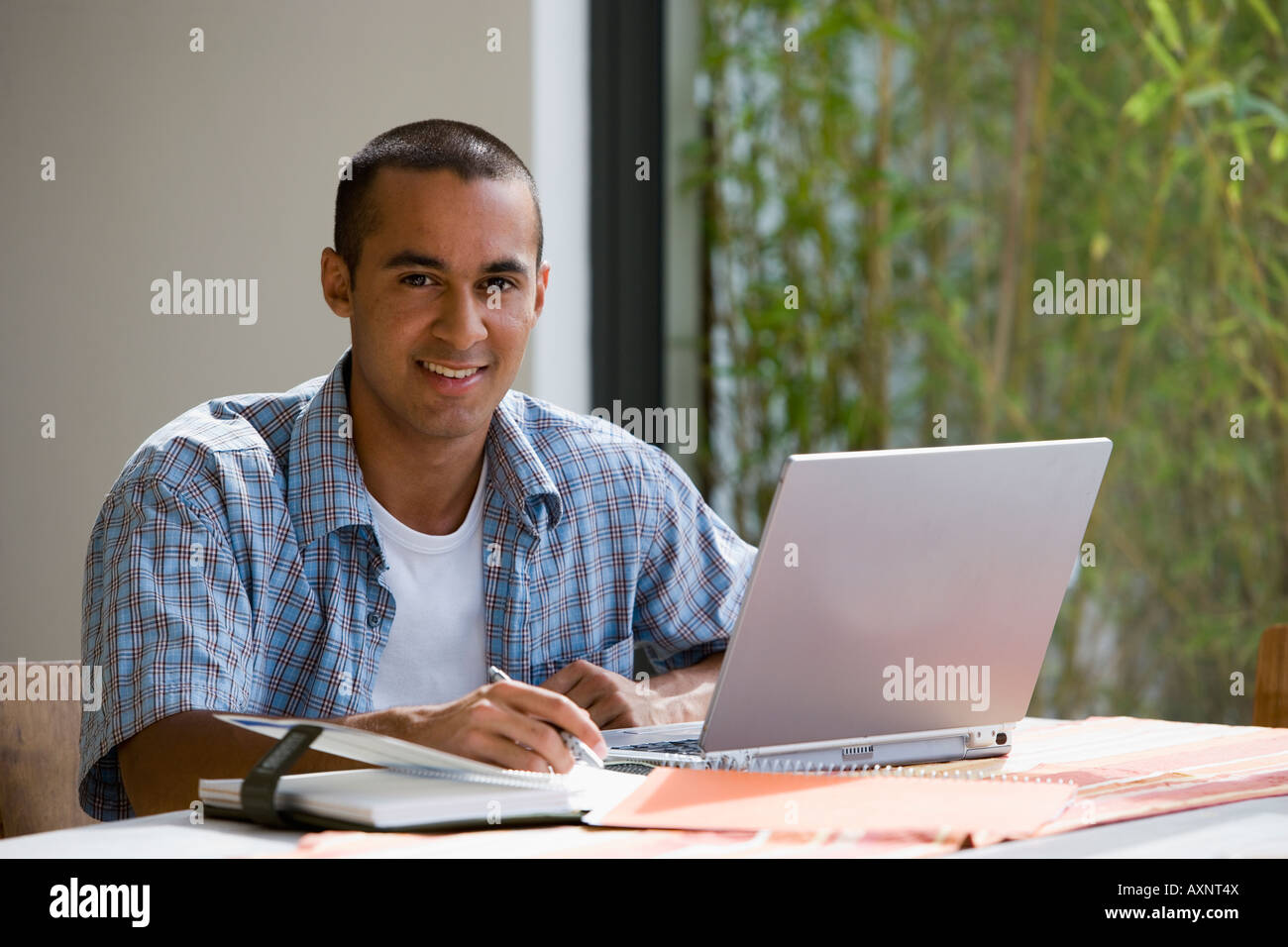 Young businessman working from home Stock Photo - Alamy