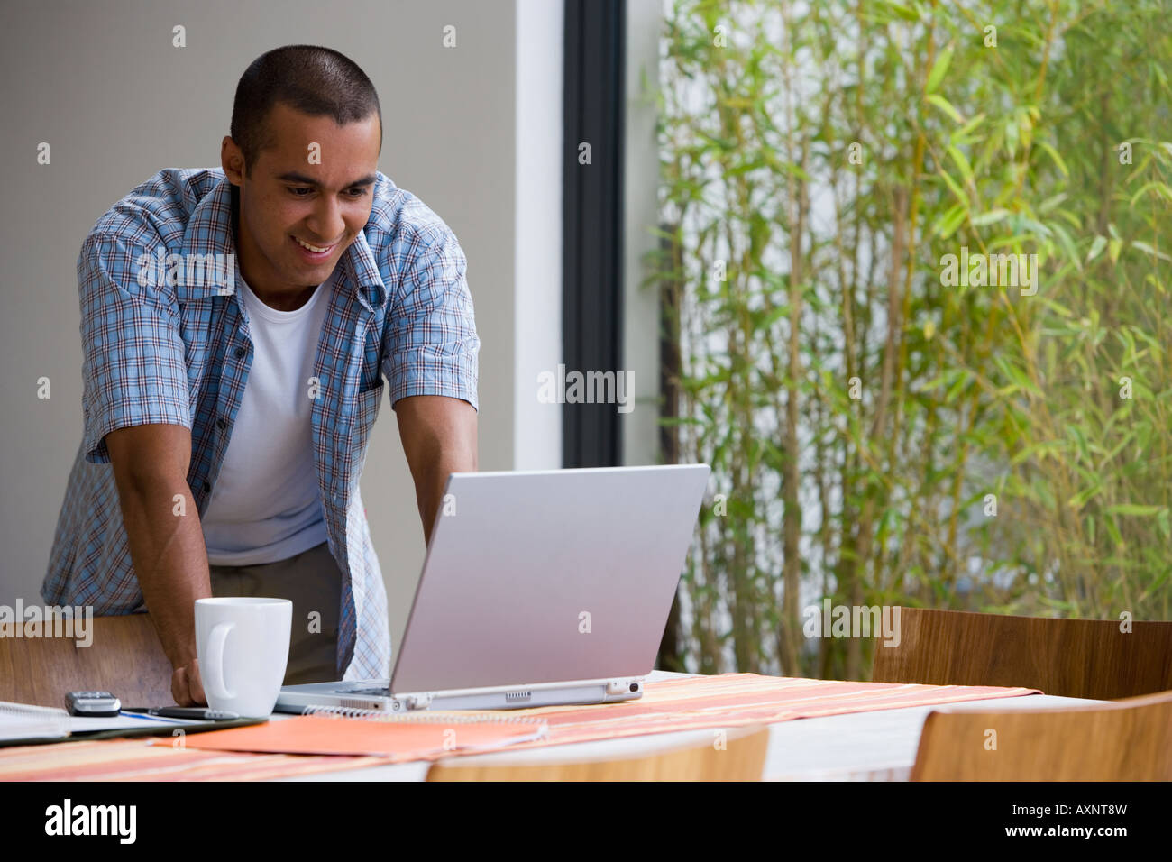 Young businessman working from home Stock Photo - Alamy