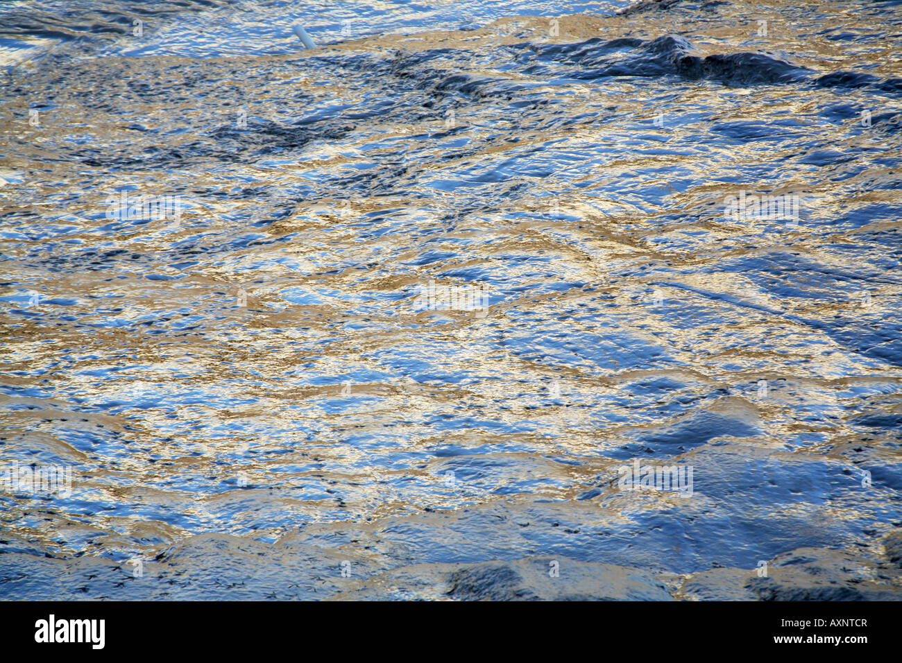 Reflections in moving water Stock Photo - Alamy