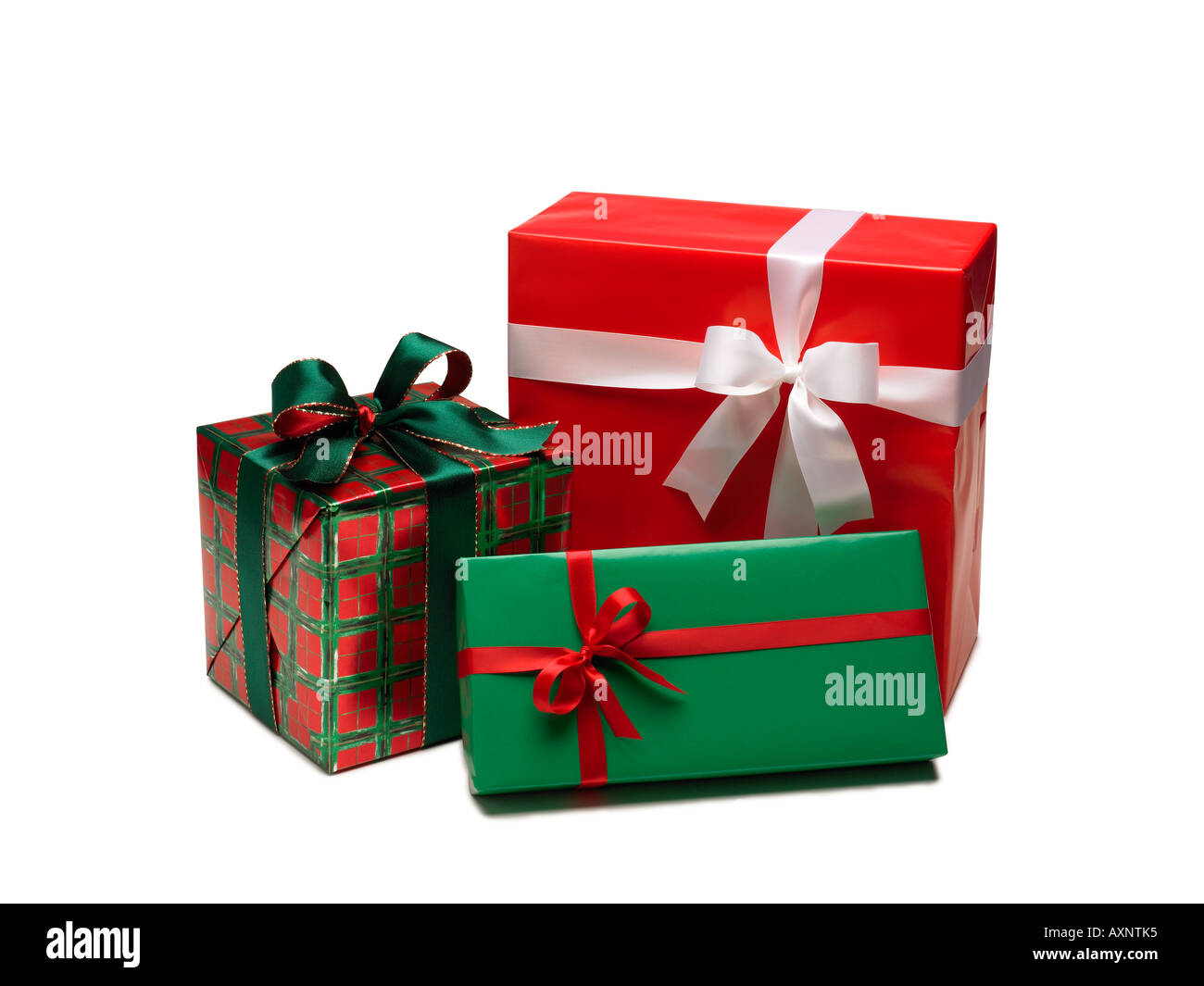 Holiday cluster of red and green gifts on white Stock Photo - Alamy