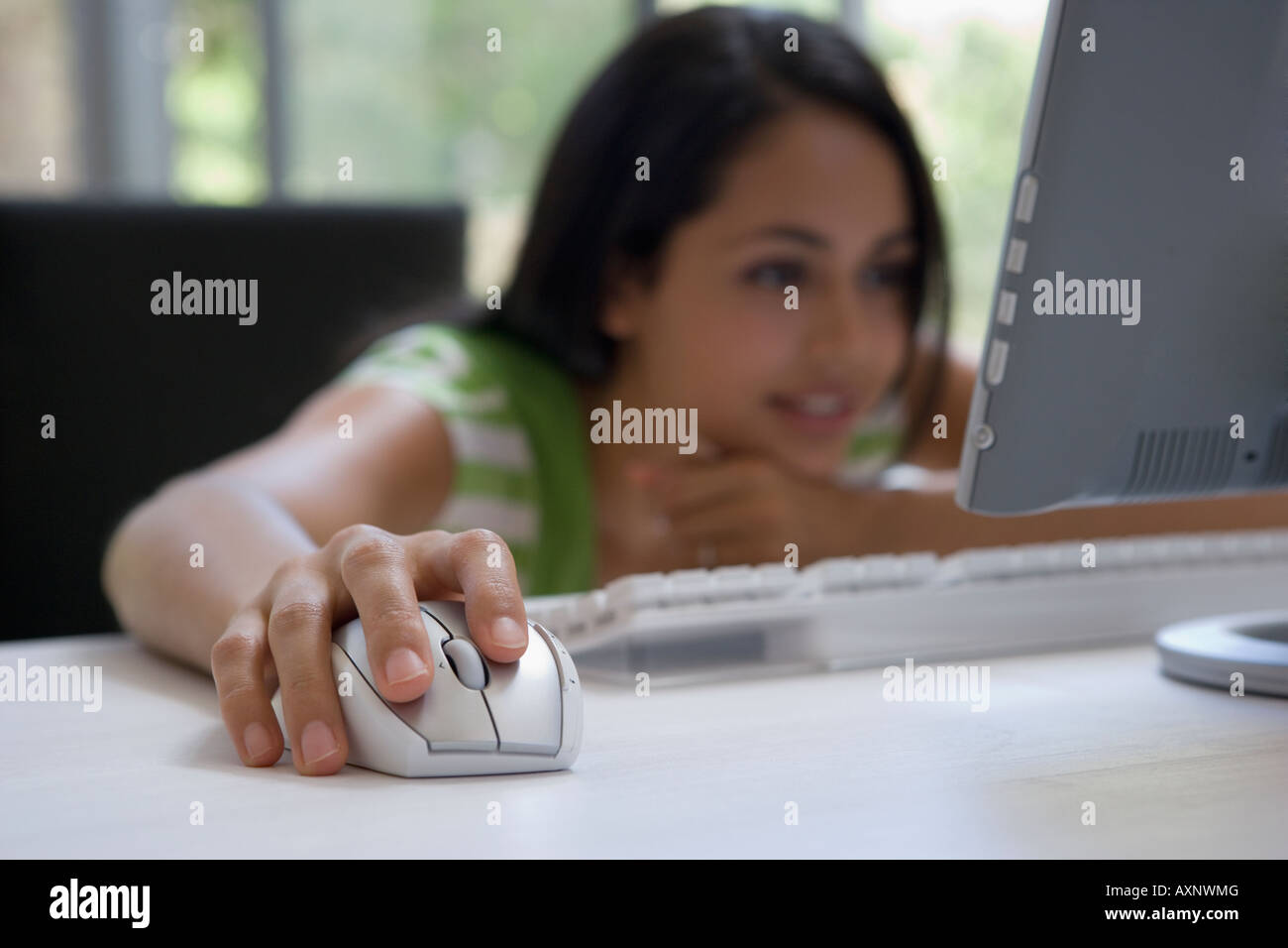 Young woman looking at looking at computer Stock Photo - Alamy