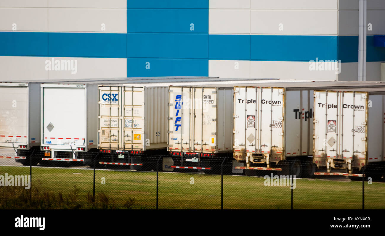 Trailers at a warehouse Stock Photo - Alamy