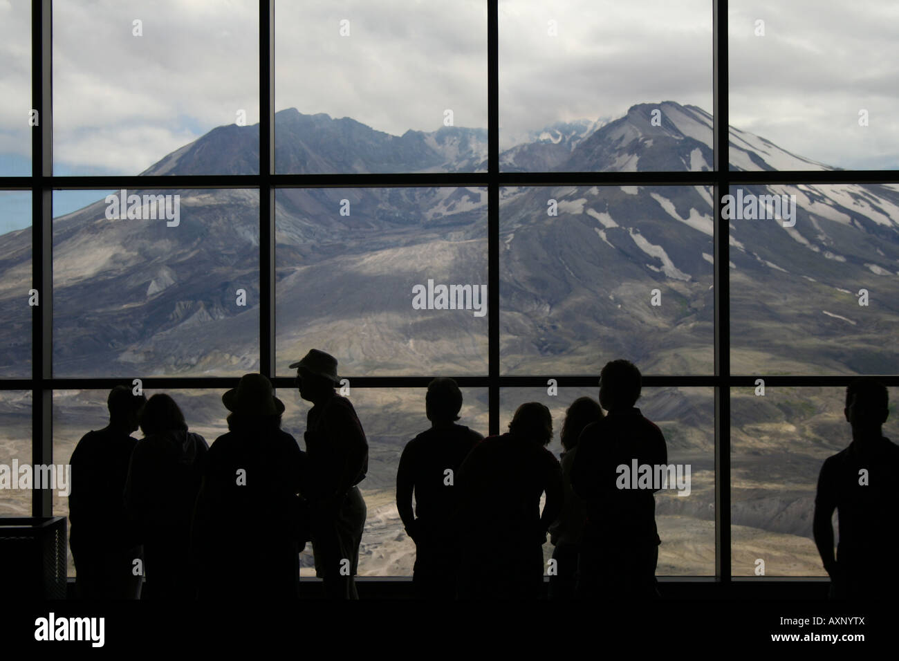visitors peer through the window after watching a film about the ...
